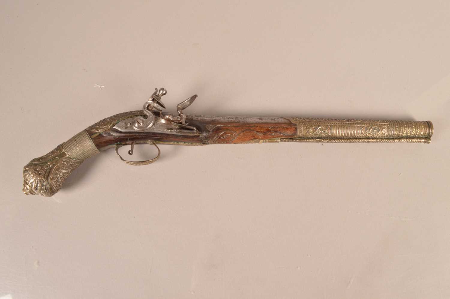 Lot 965 - A Decorative Middle Eastern Flintlock pistol,