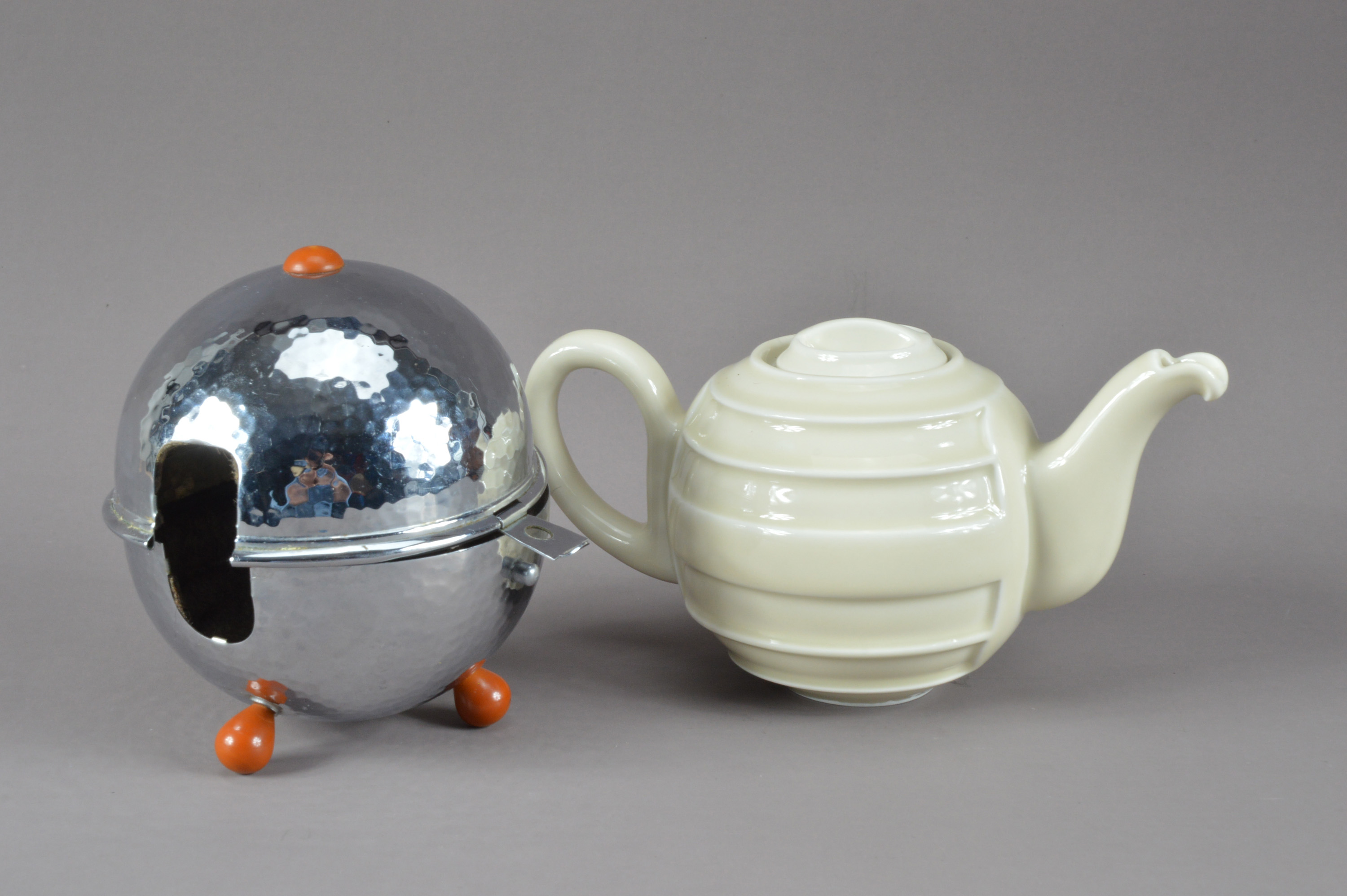 Lot 184 - A circa 1950's German teapot in stand by WMF,
