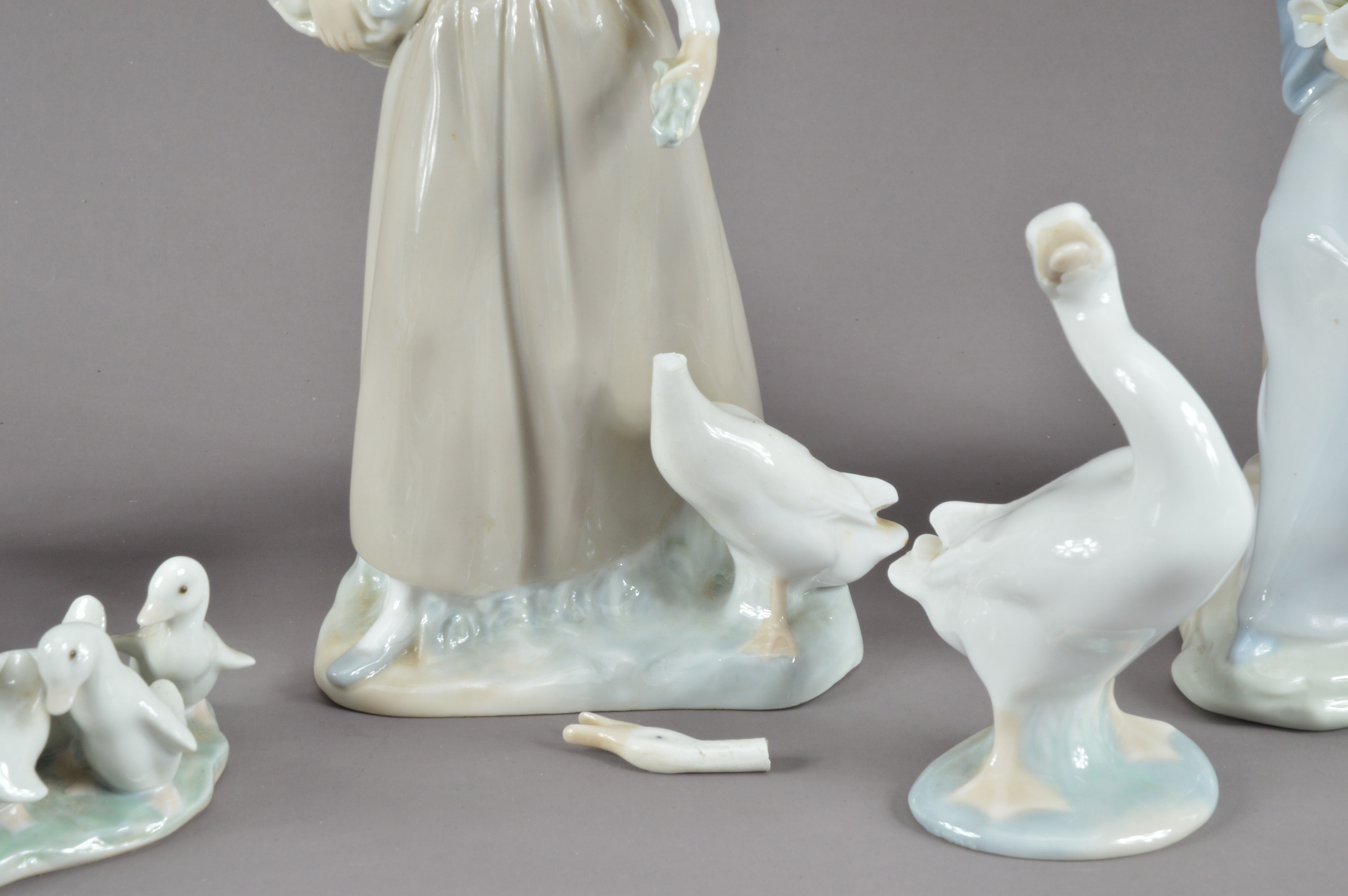 Lot 196 - A collection of Lladro porcelain figurines,