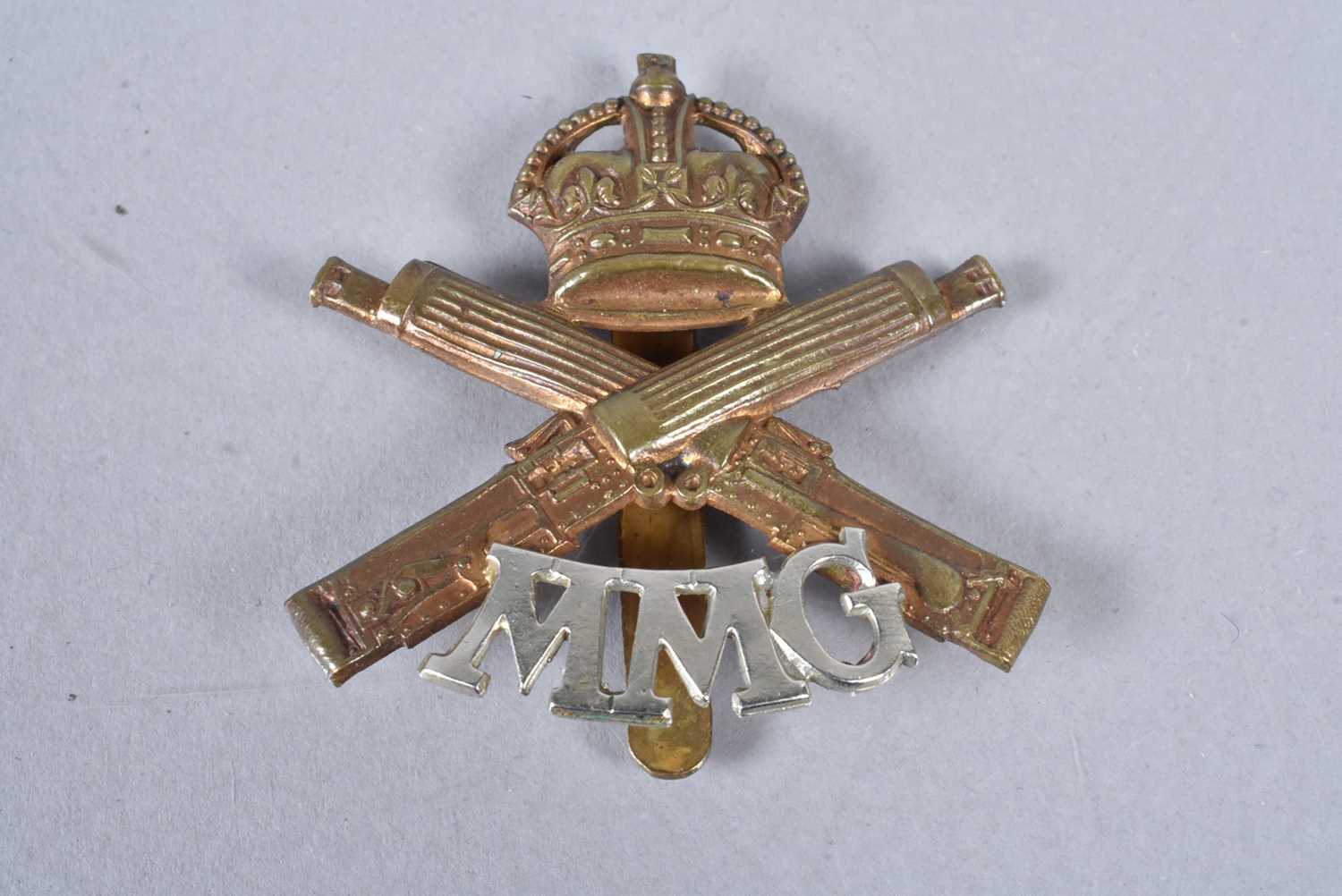 Lot 664 - A WWI Motor Machine Gun Corps Bi-Metal badge,