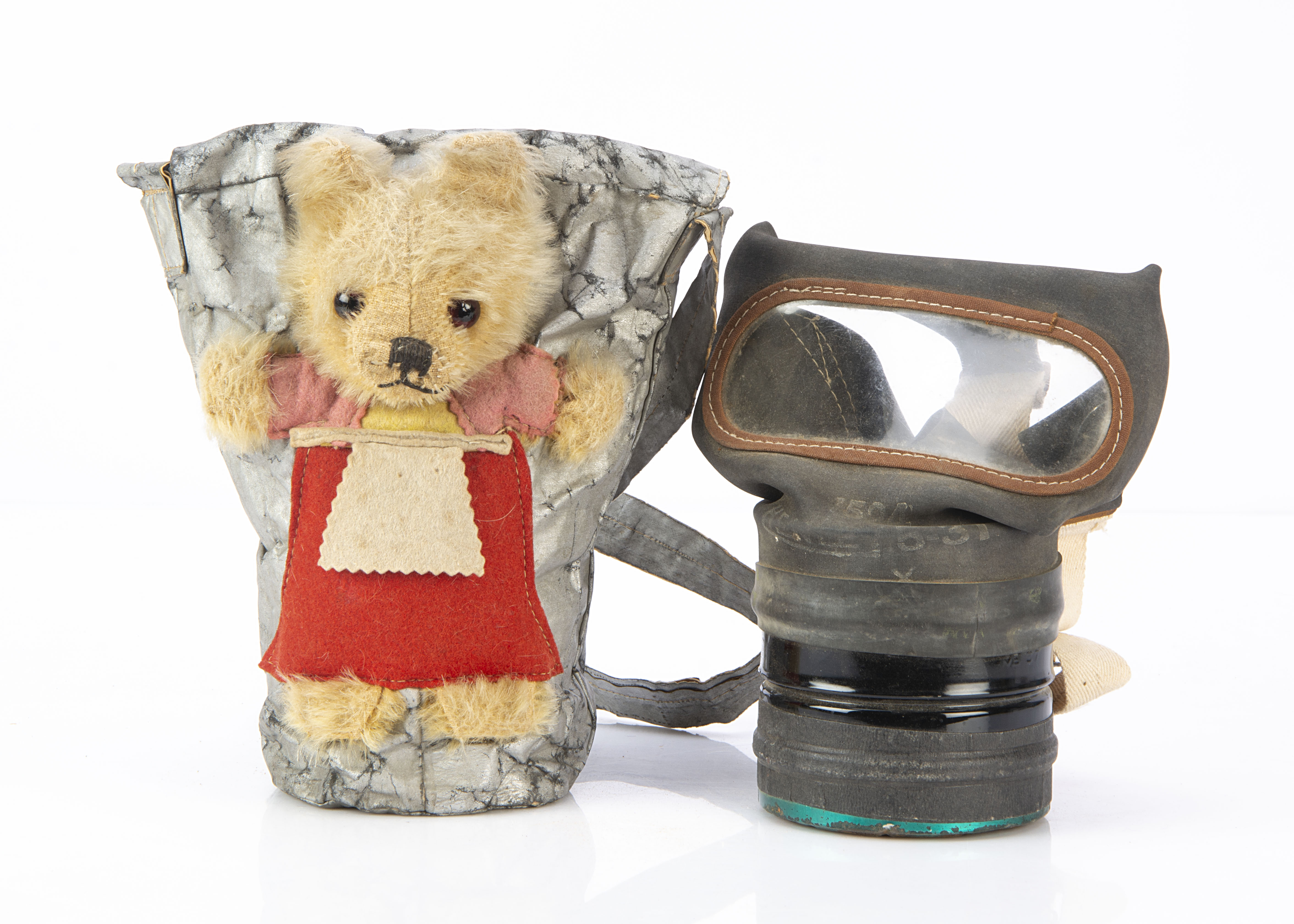 Lot 241 - A Farnell WW2 child's gas mask in a teddy