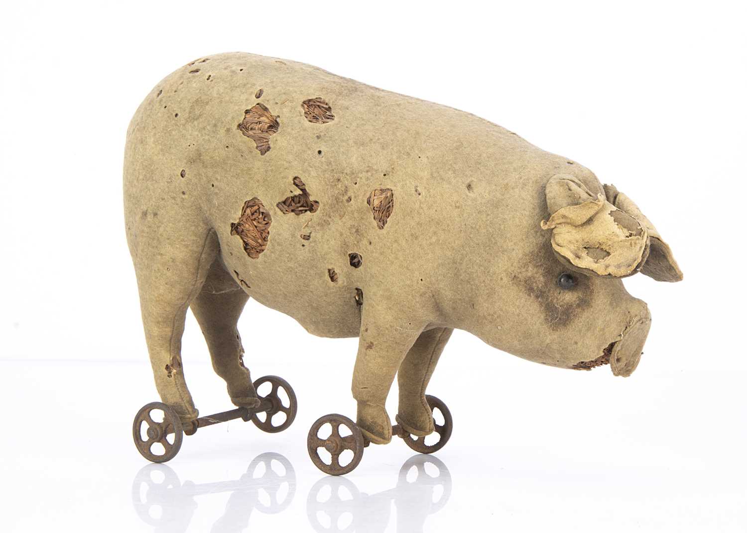 Lot 331 - An early Steiff felt pig on wheels circa