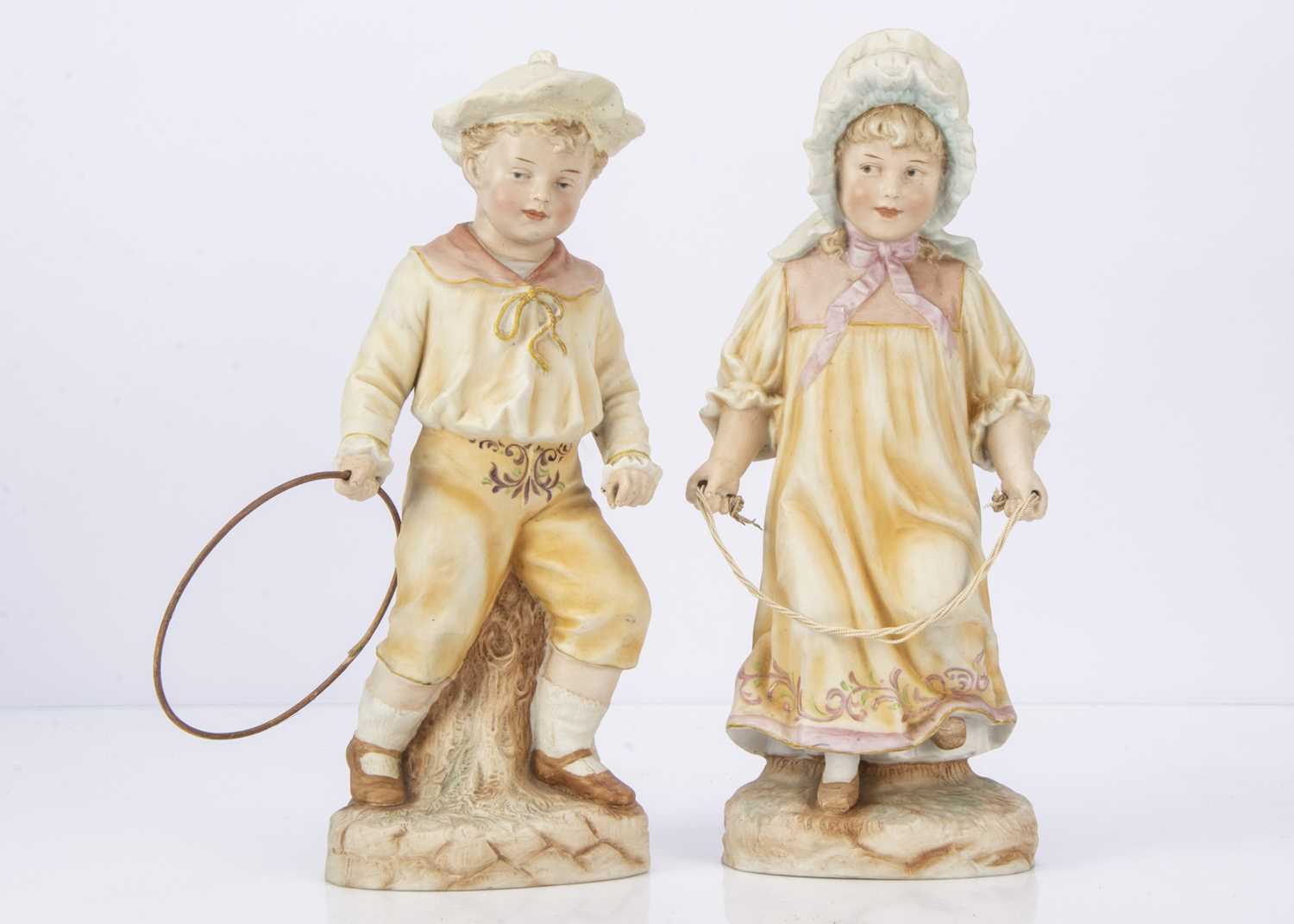 Lot 973 - A pair of Gebruder Heubach children playing,