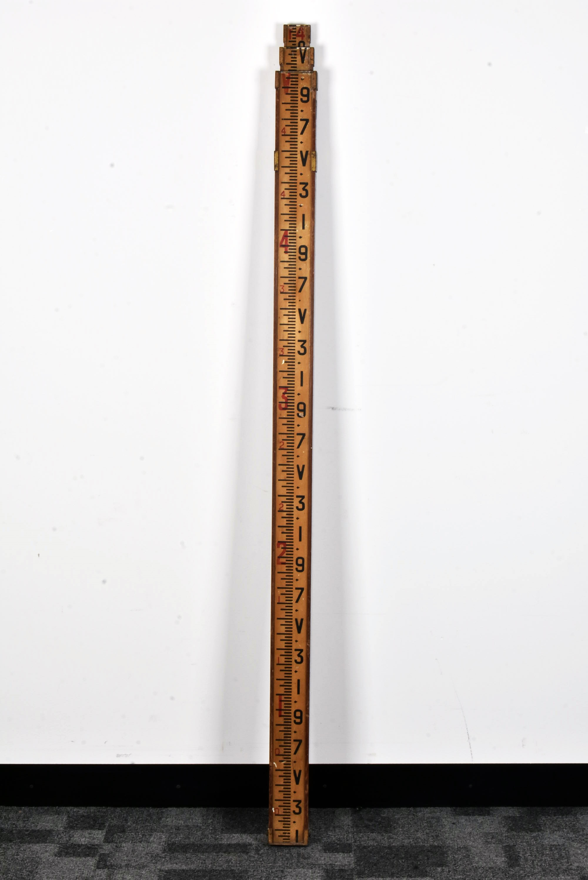 Lot 130 - An extendable measuring stick,