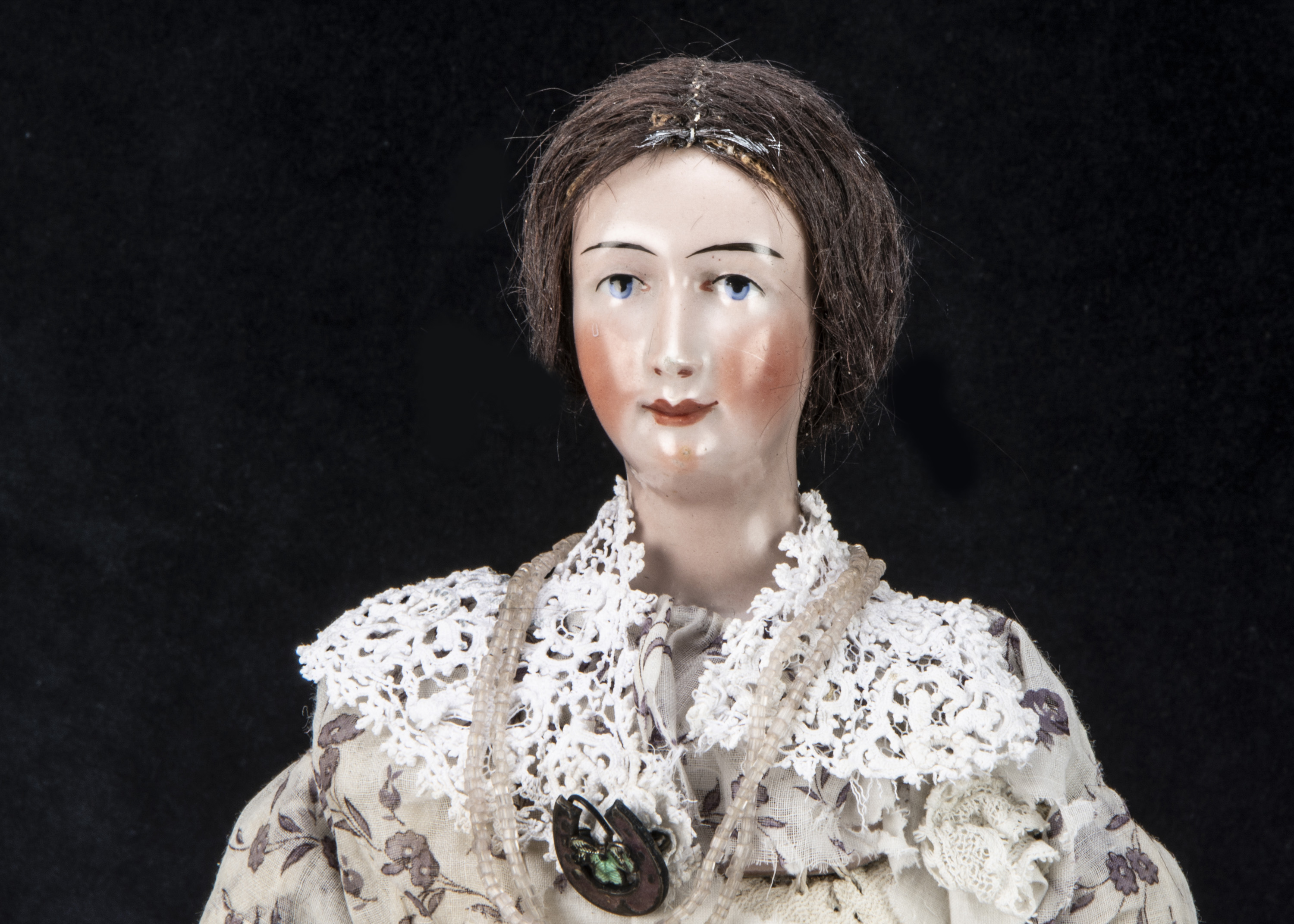 Lot 245 - A rare early German pink tinted china wigged