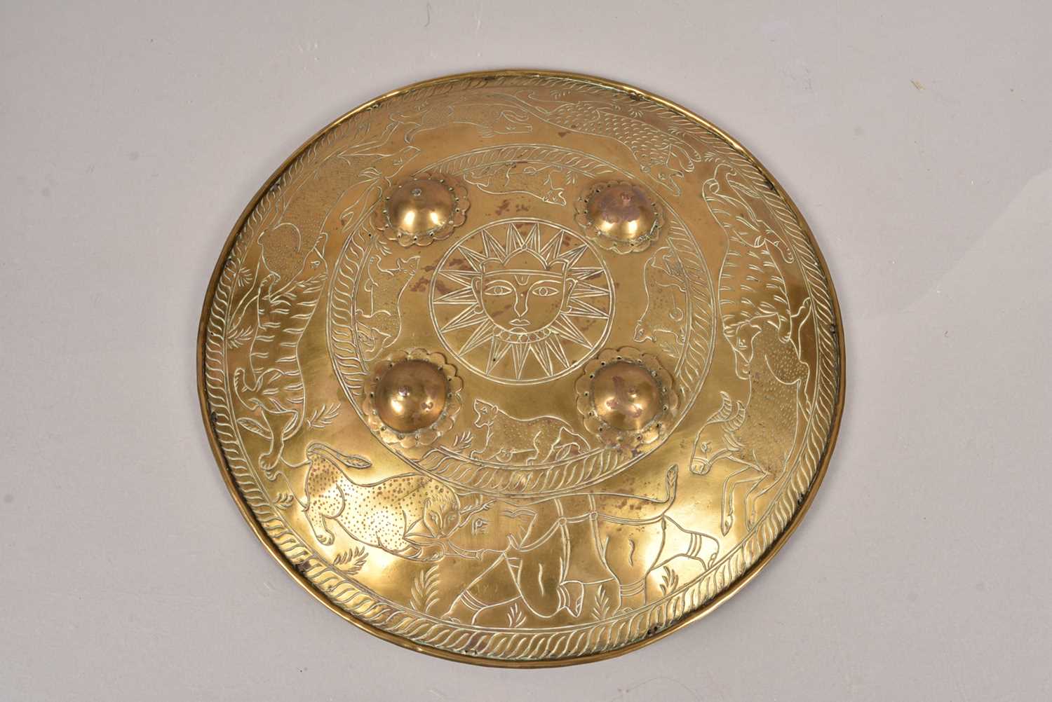 Lot 271 - A Middle Eastern Brass circular shield,