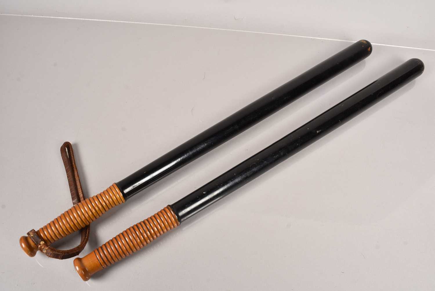 Lot 344 - Two large wooden Police Truncheons,