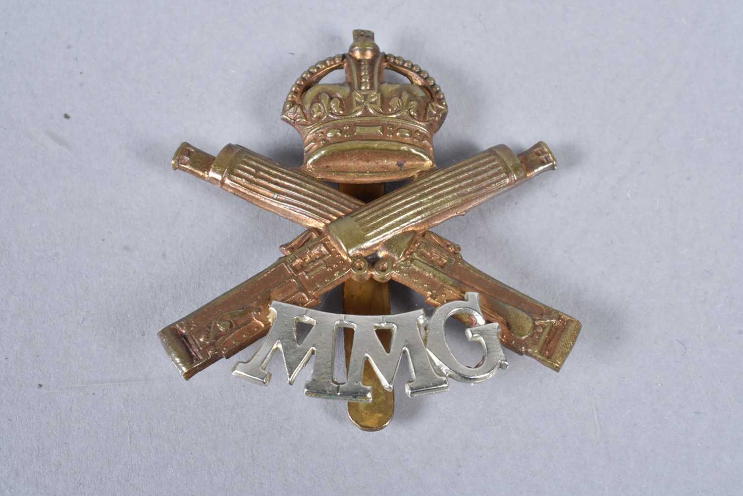 Lot 630 - A WWI Motor Machine Gun Corps Bi-Metal badge,