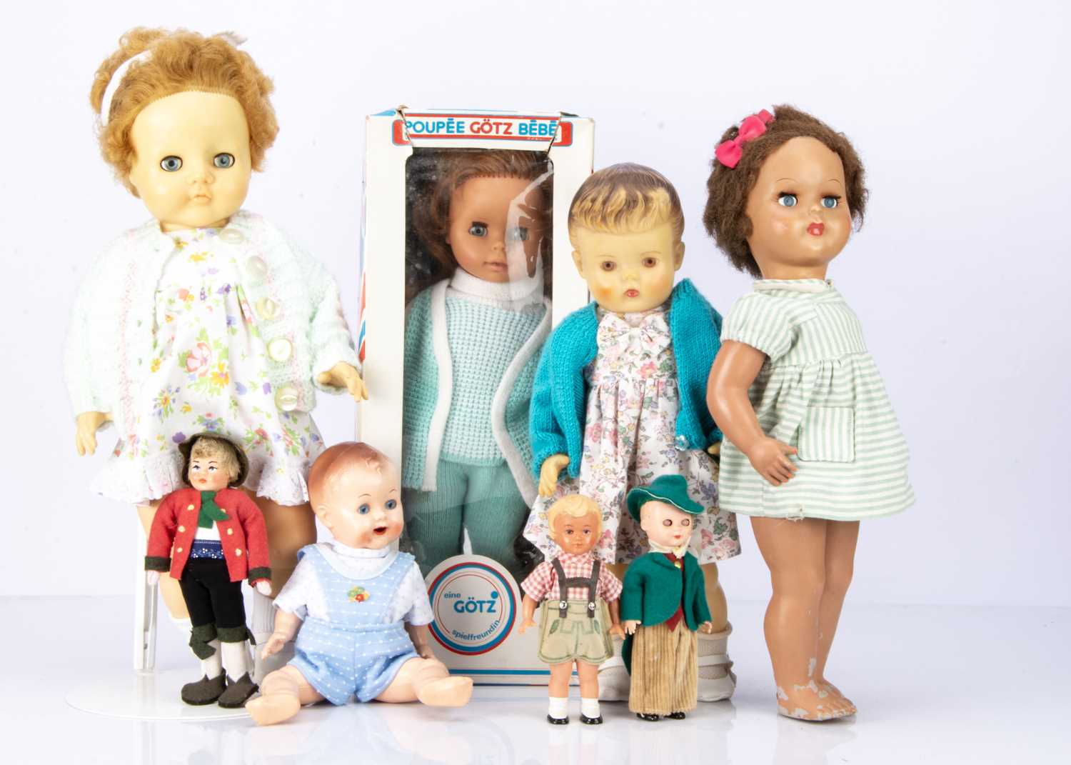 Lot 373 - Eight, plastic and celluloid dolls,