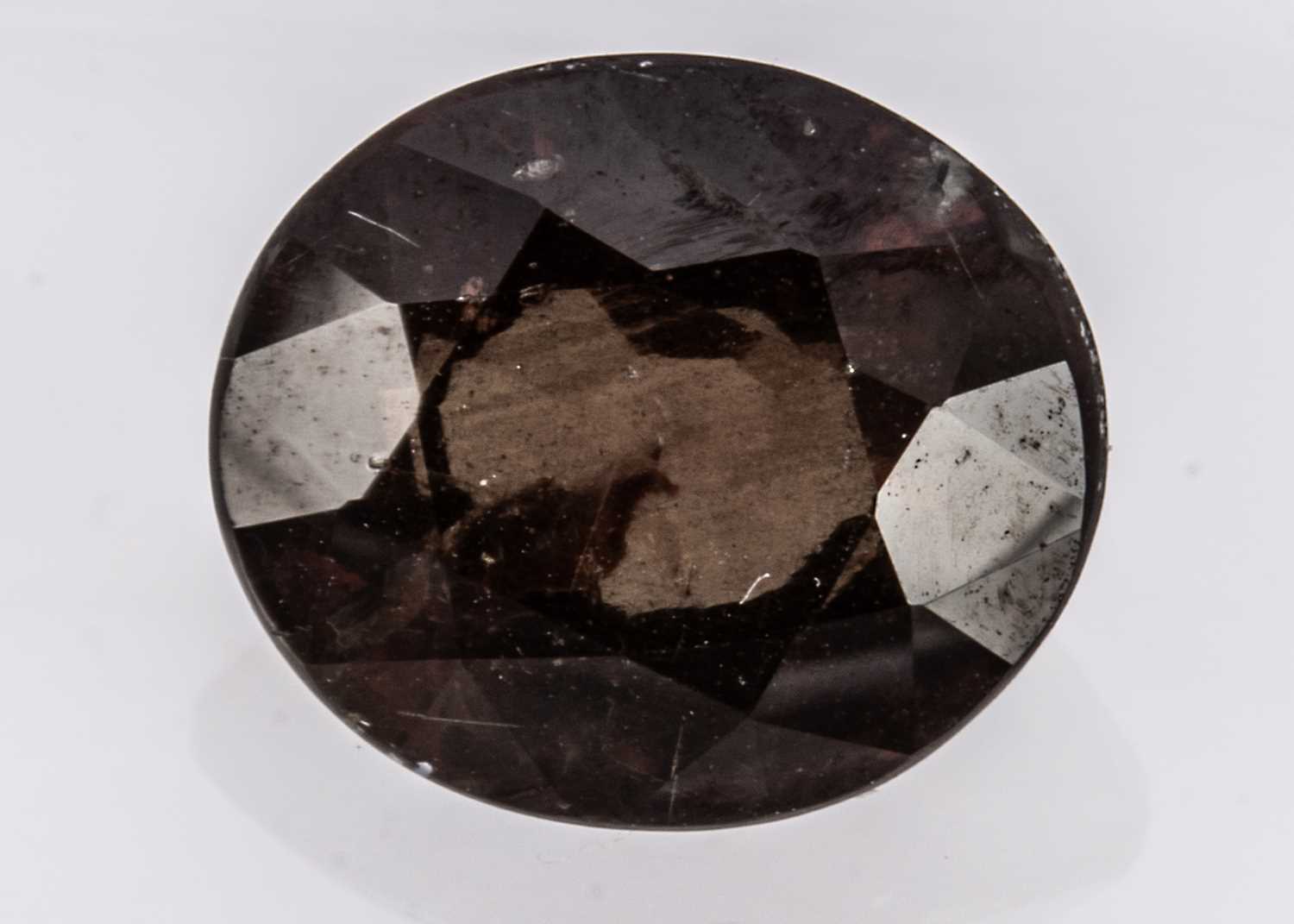 Lot 302 - A certificated oval cut Garnet,