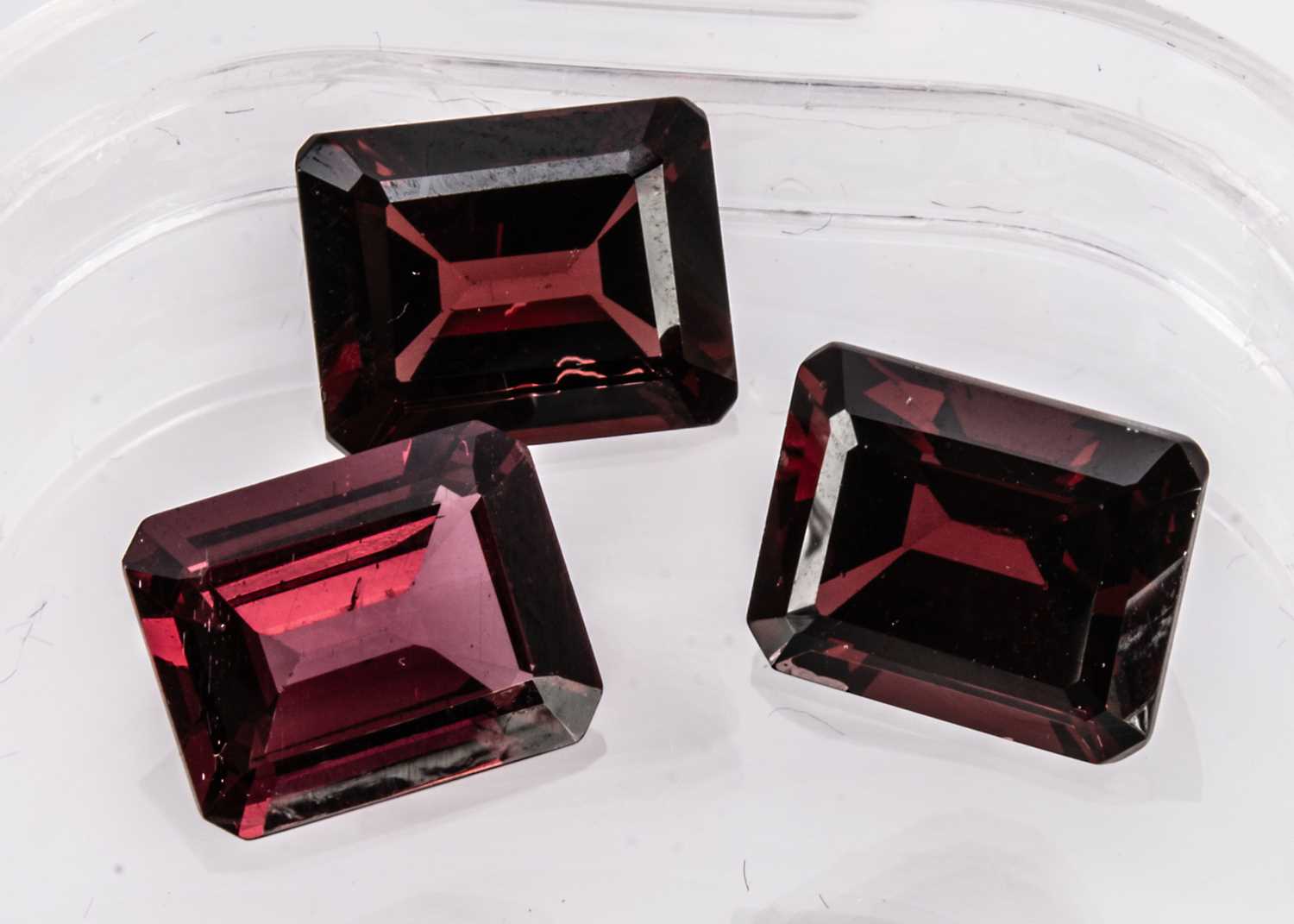 Lot 346 - Three certificated Rhodolite Garnets,