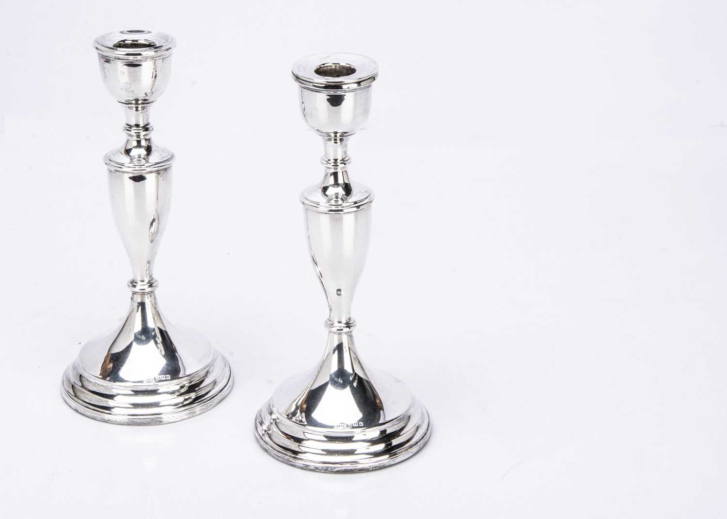 Lot 392 - A pair of 1960s silver filled candlesticks