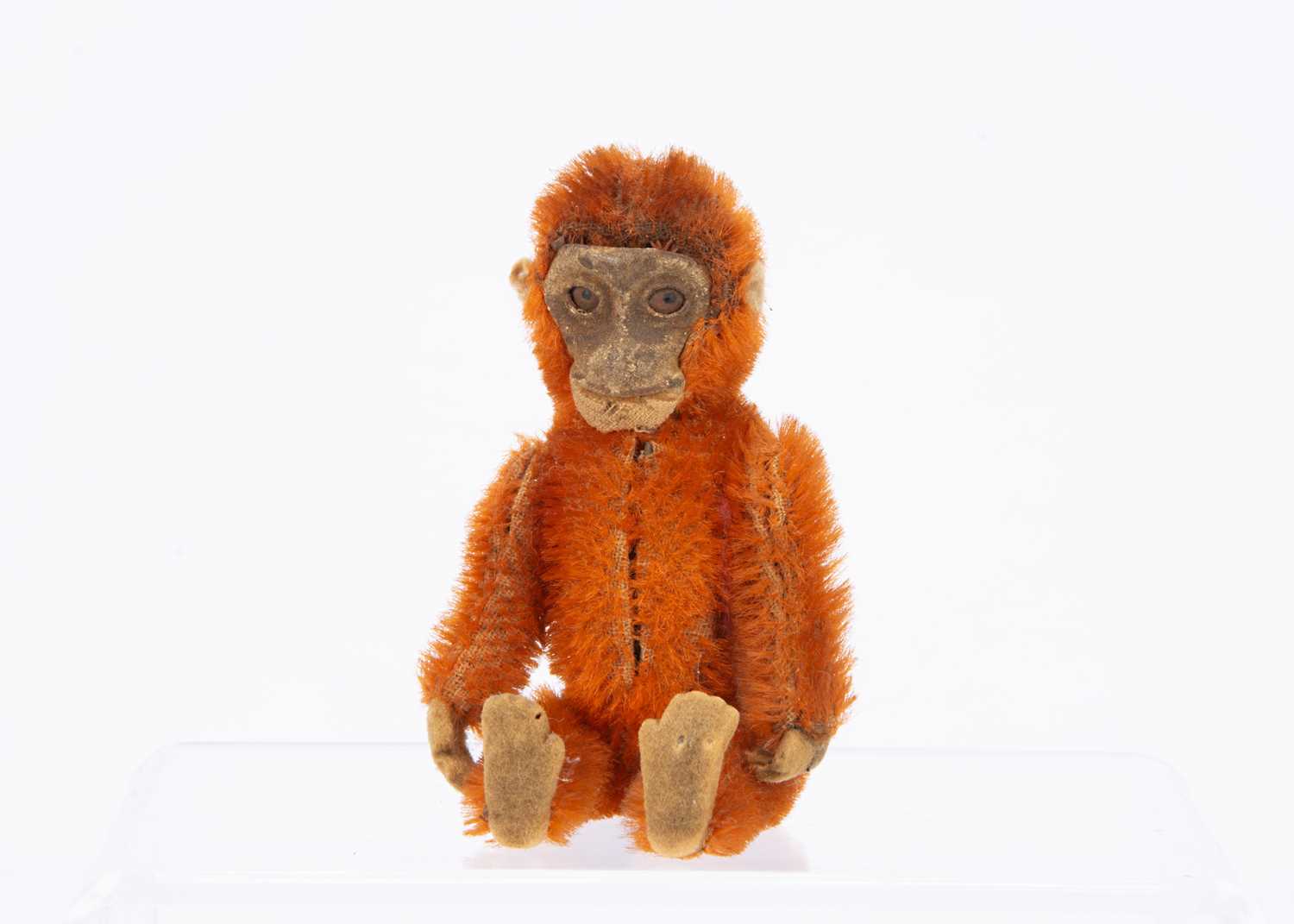Lot 234 - A 1920s Schuco monkey perfume bottle,