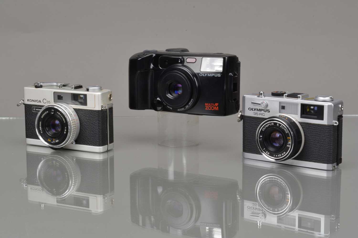 Lot 319 - Three Compact Cameras,