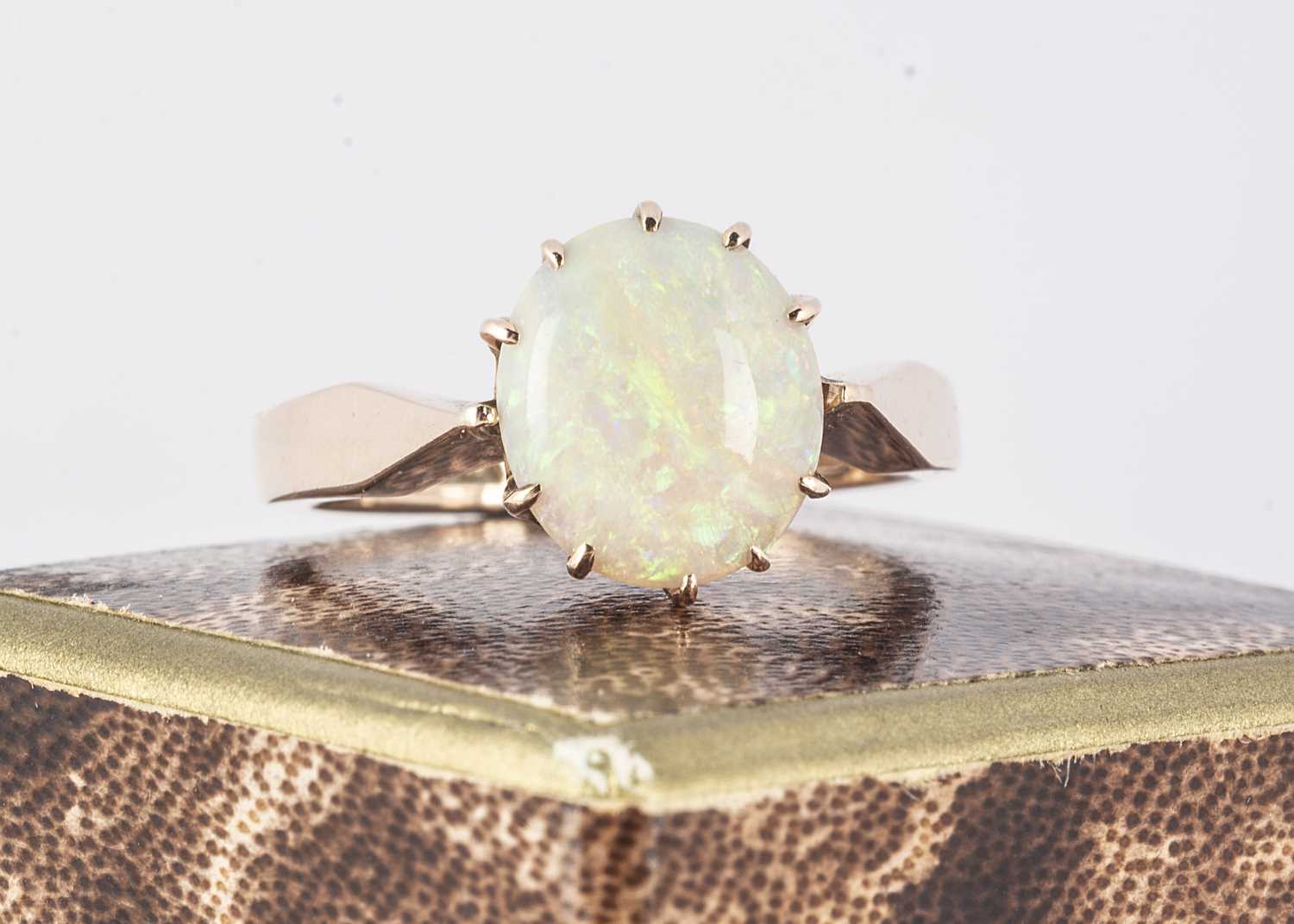 Lot 344 - A 9ct gold circular opal ring,
