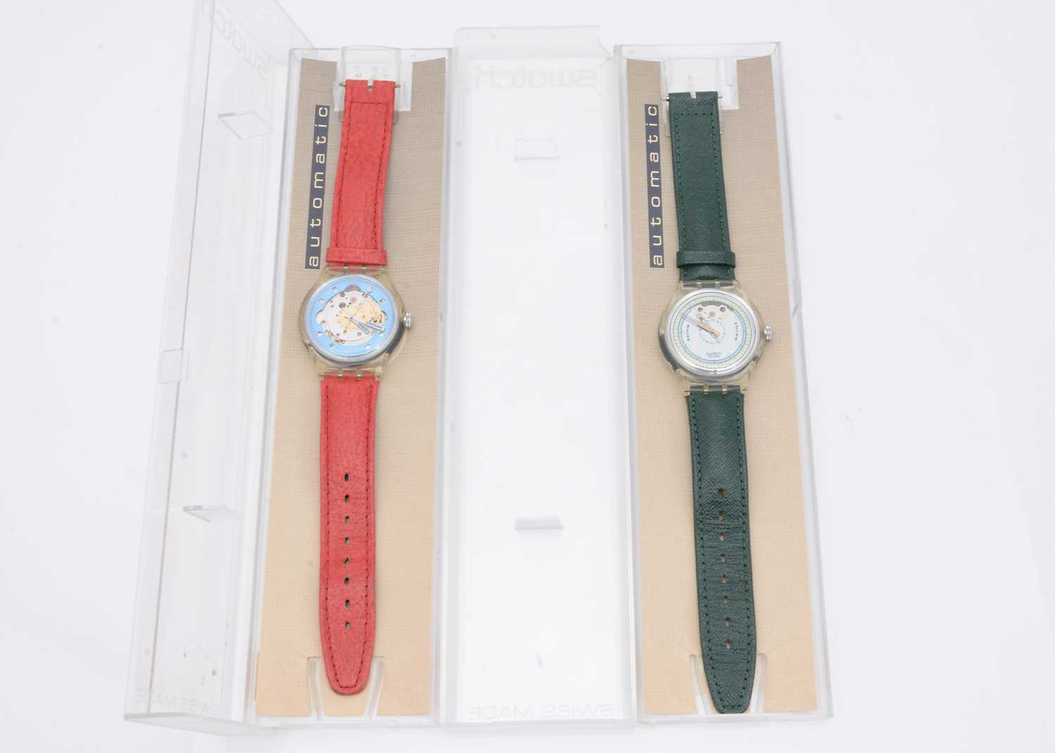 Lot 176 - Two modern Swatch automatic wristwatches,