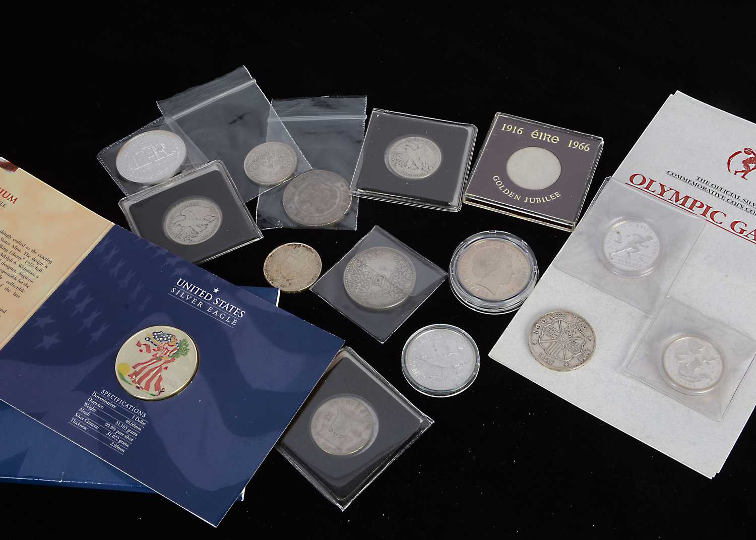 Lot 122 - A collection of fifteen world silver coins,