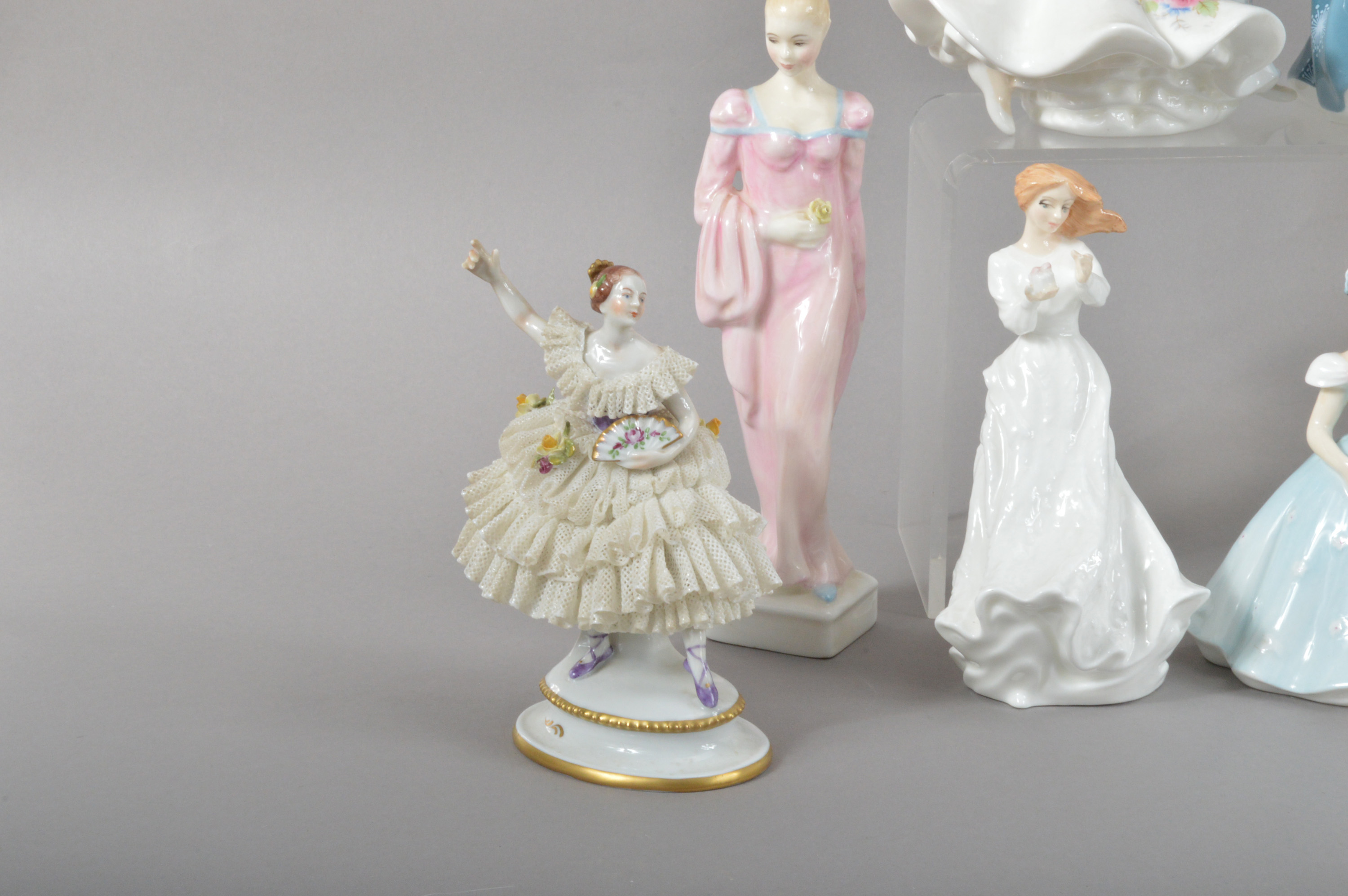 Lot 29 - A large collection of ceramic lady figurines,