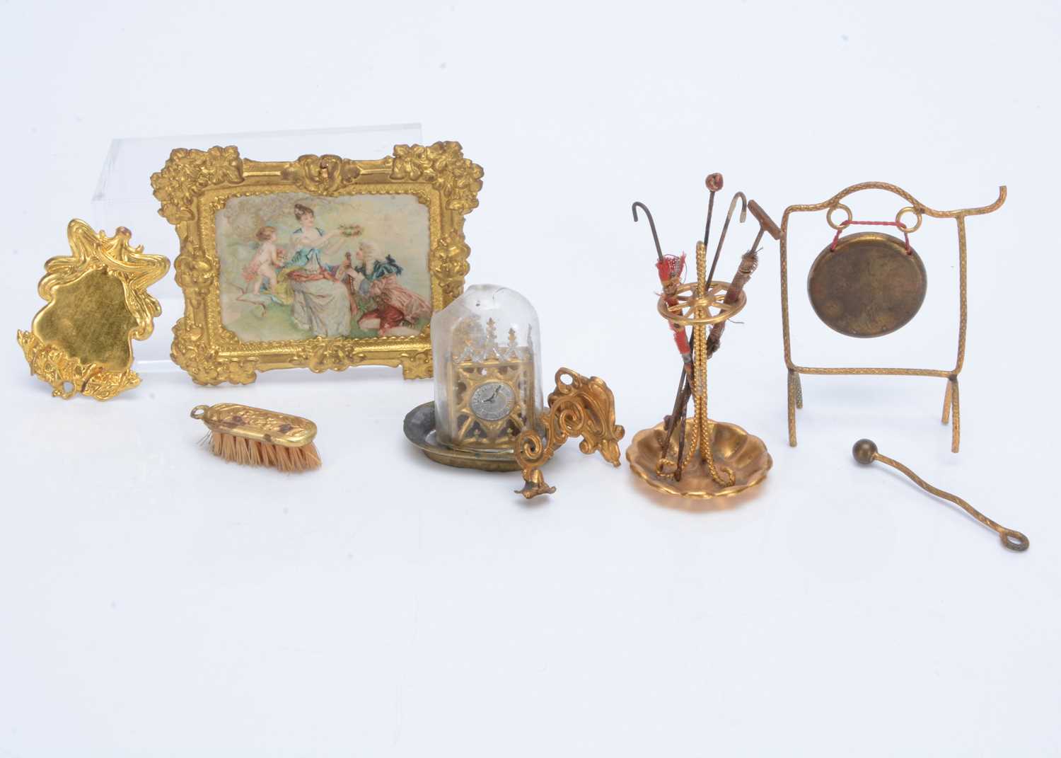 Lot 615 - German gilt metal dolls’ house chattels,