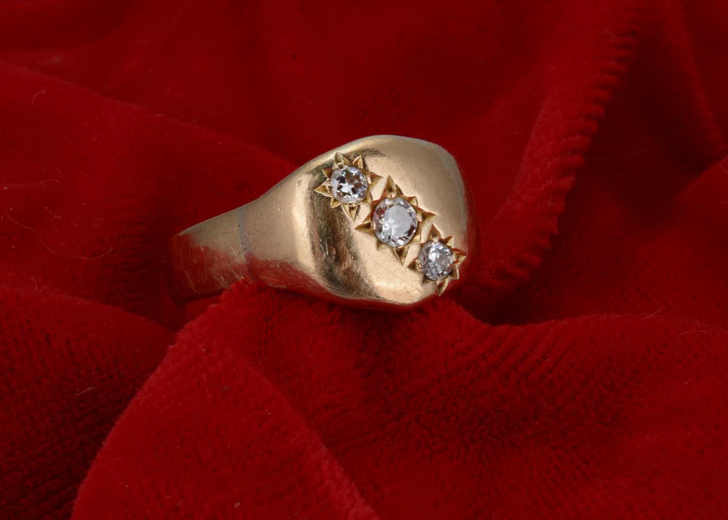 Lot 223 - An 18ct gold and diamond set signet ring,