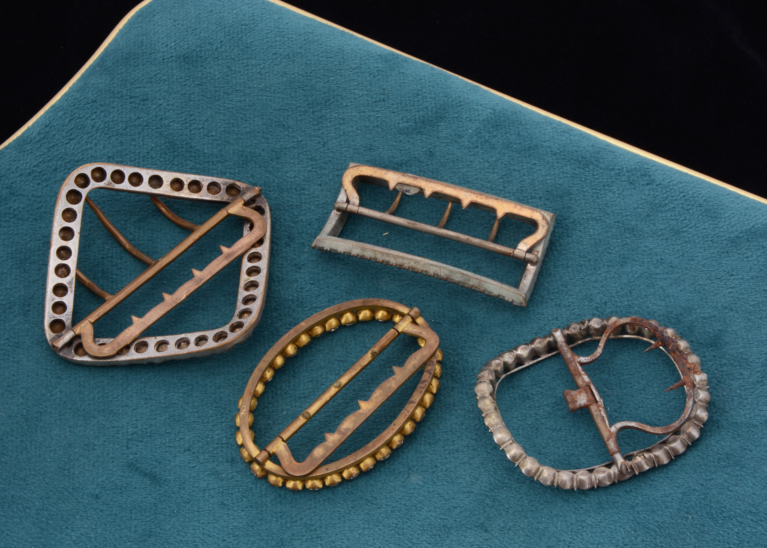 Lot 50 - Four paste set buckles,