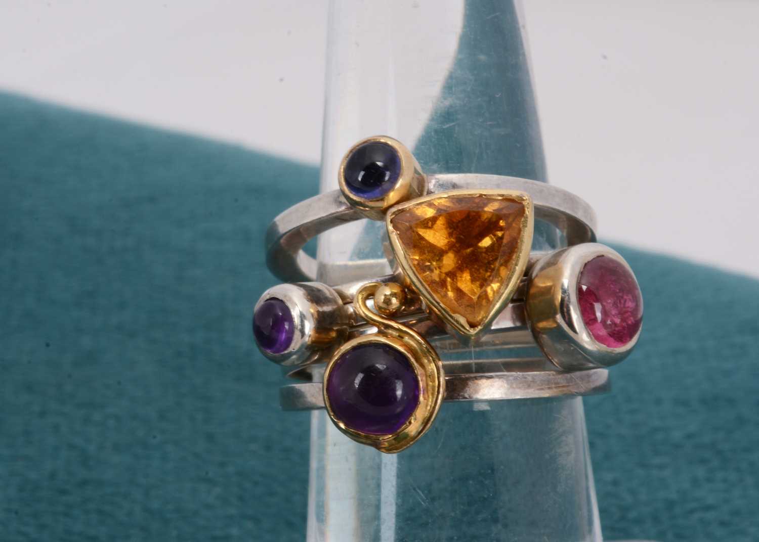 Lot 178 - A set of silver gem set stacking rings,