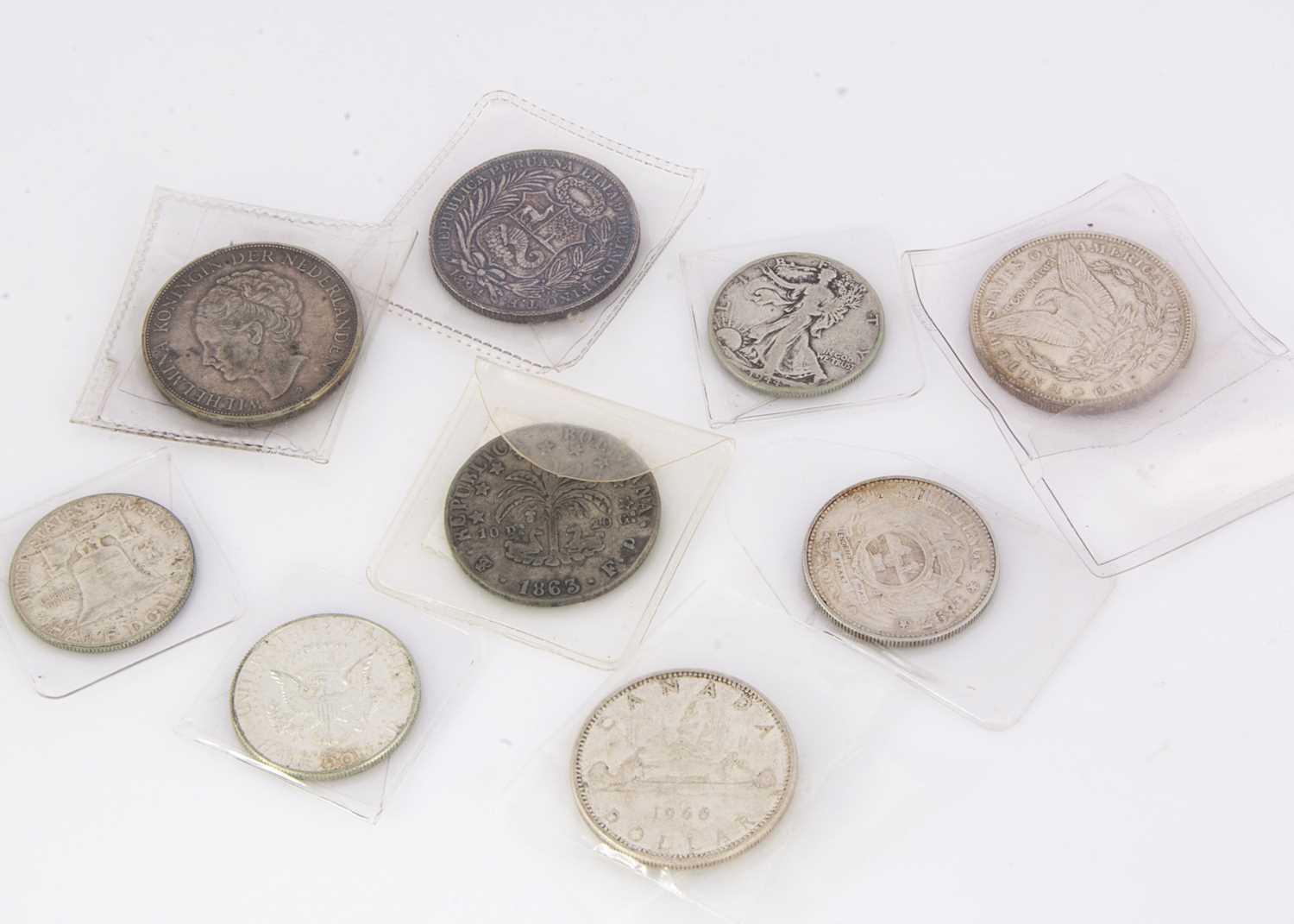 Lot 238 - A collection of nine silver world coins,