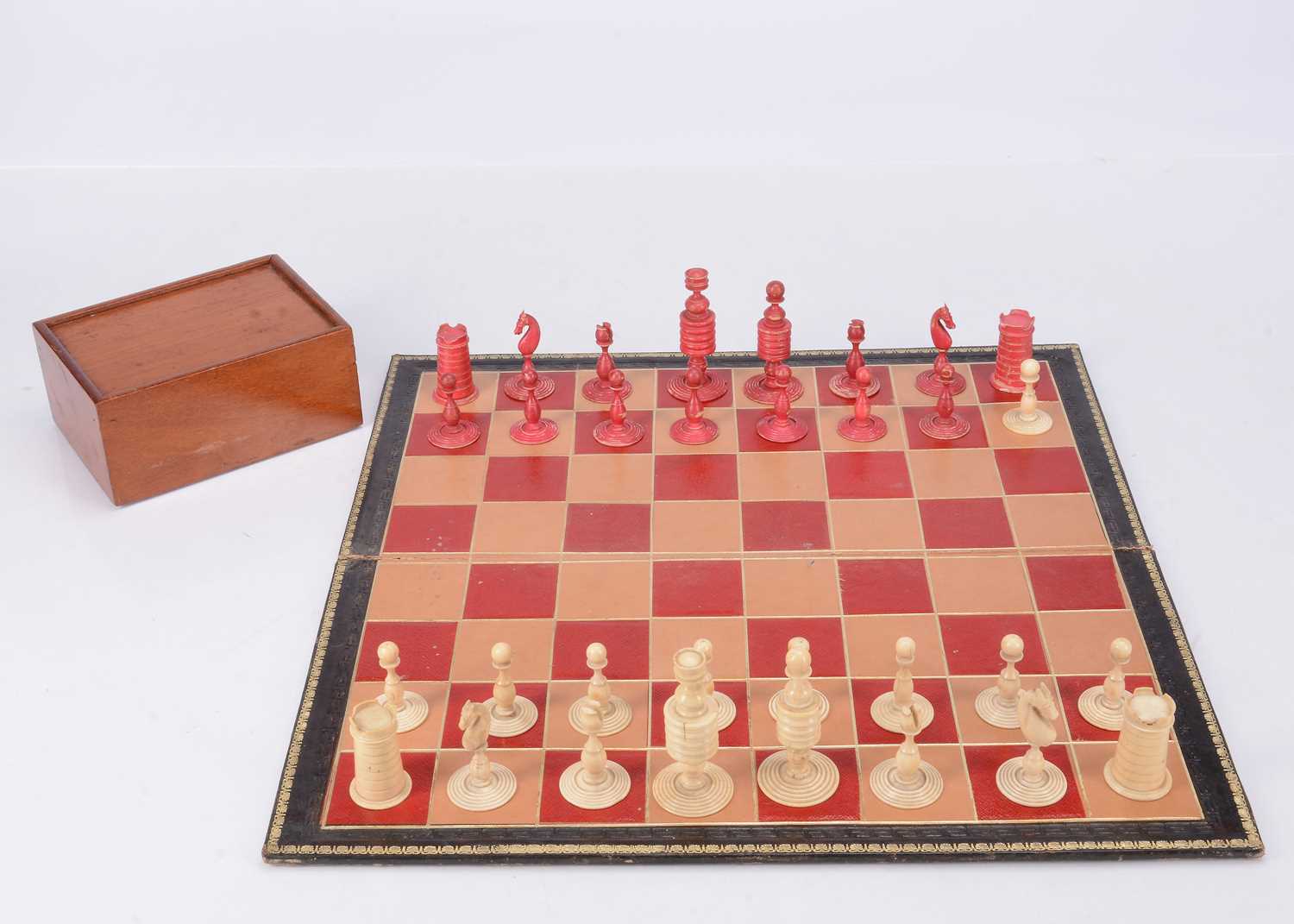 Lot 129 - A 19th century turned bone chess set,