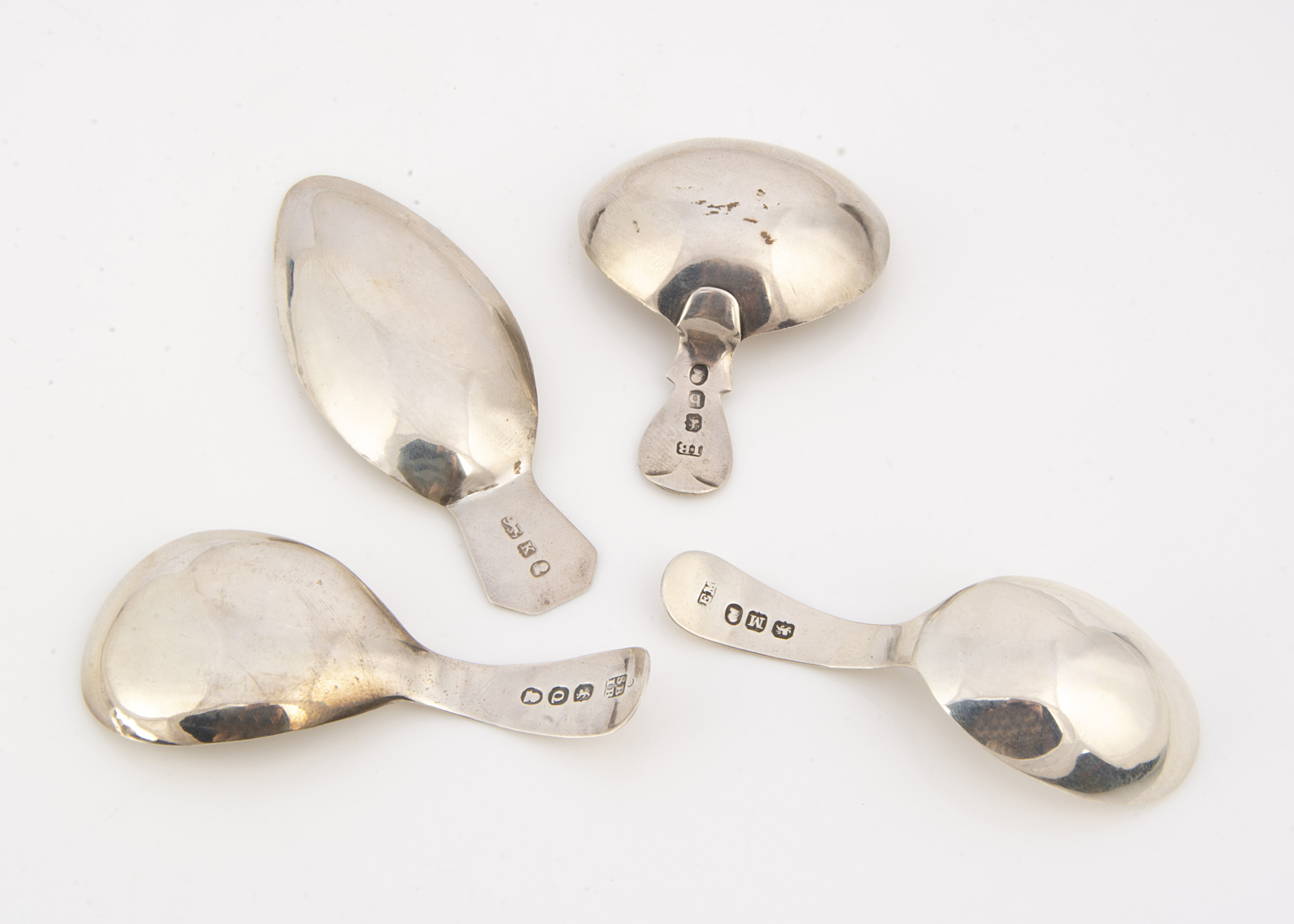 Lot 215 - Four Georgian period silver tea caddy spoons,